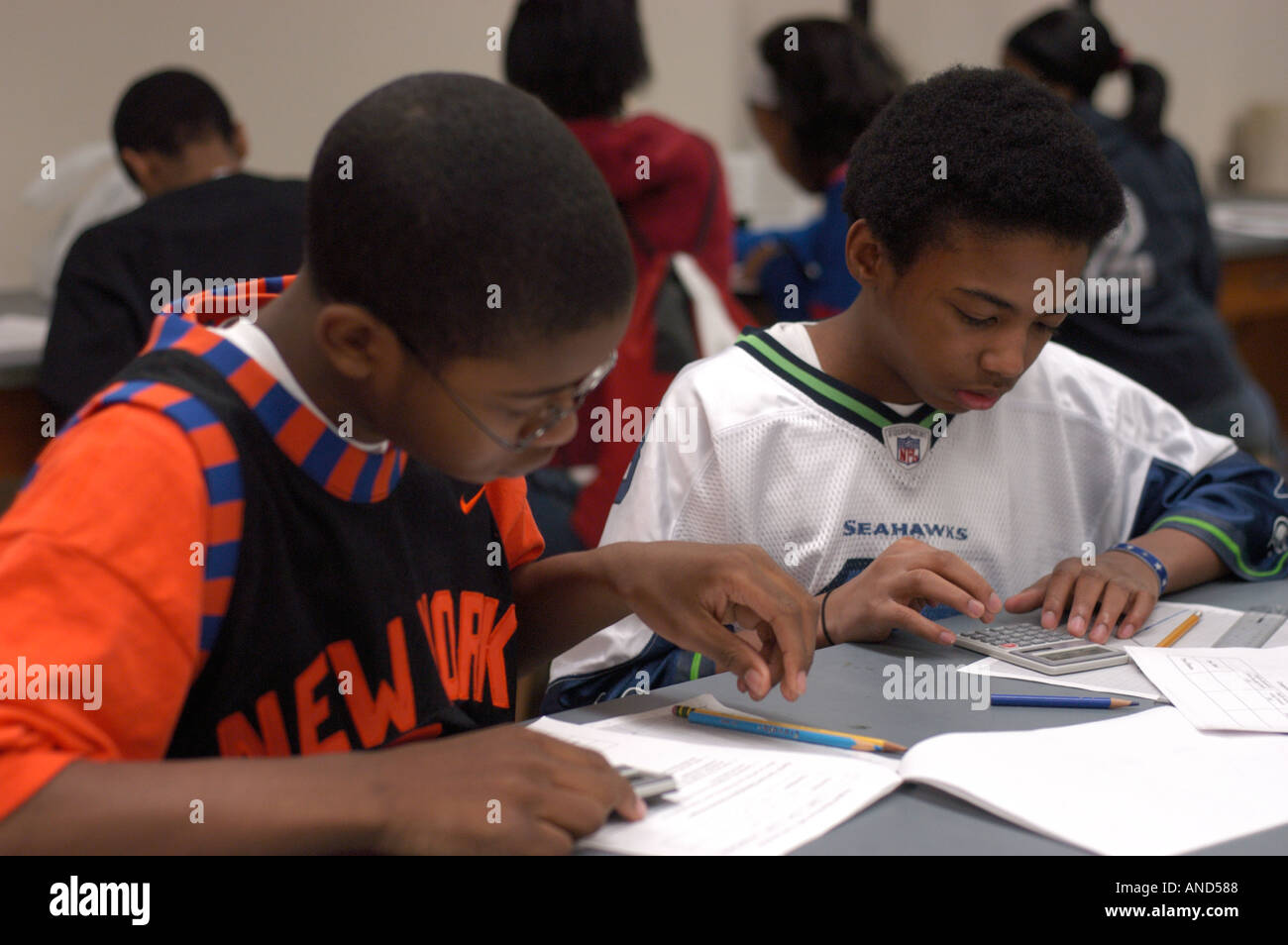Two students working on an assignment in a classroom Stock Photo - Alamy