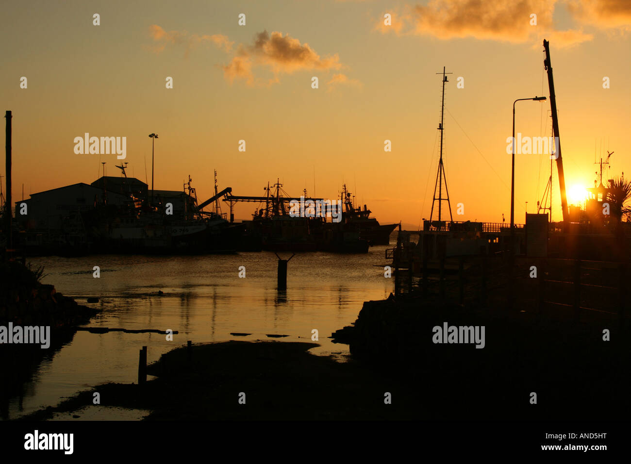 sunset at Moville fishing harbour, by the edge of Lough Foyle, Donegal ...