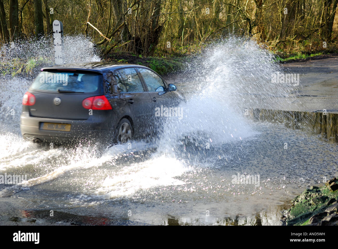 Car driving through ford hi-res stock photography and images - Alamy