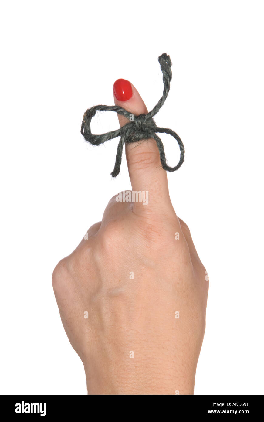 A finger contains a bow tied string as a reminder to perform a specific ...