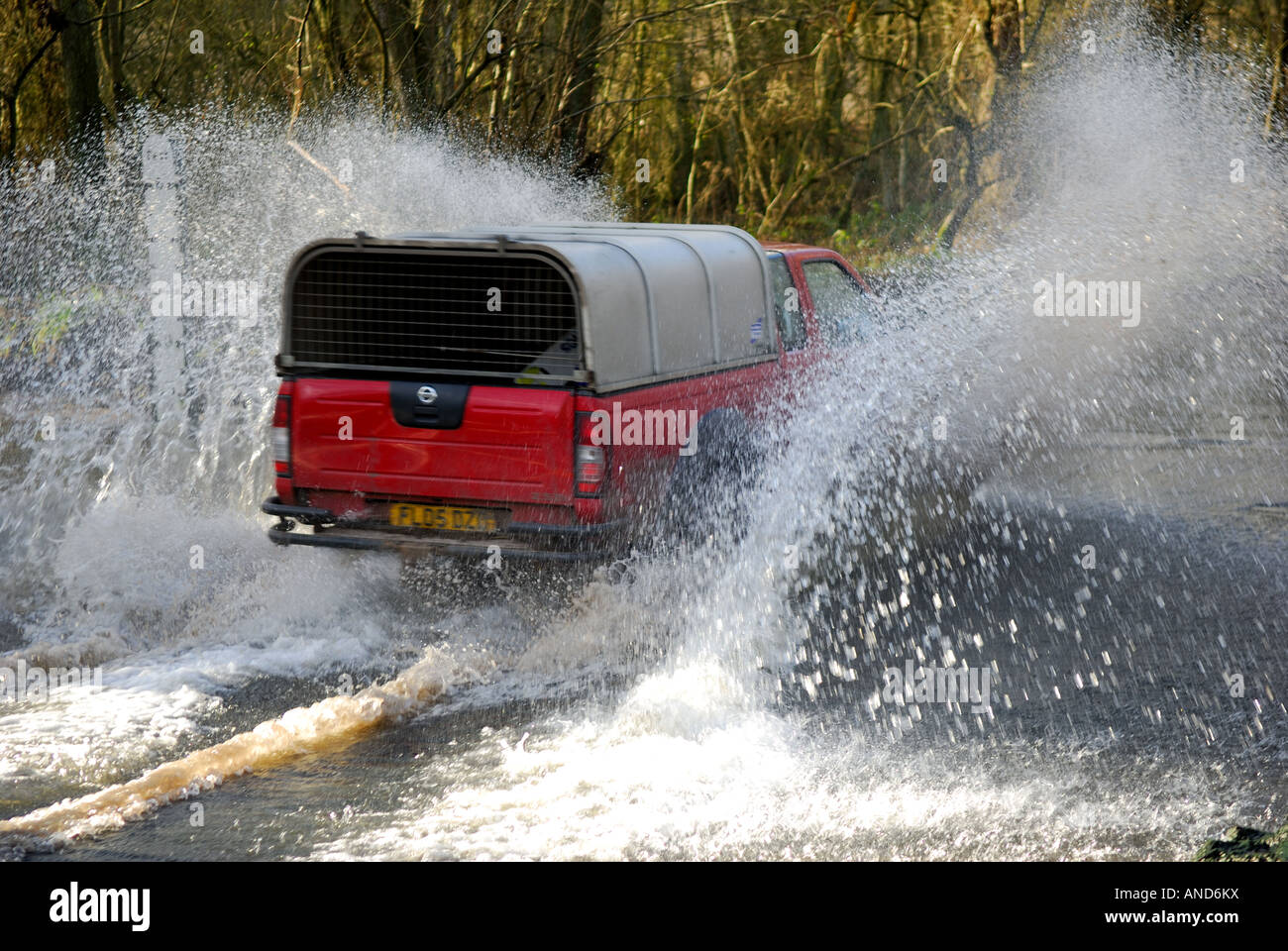 Vehical passes through ford Stock Photo - Alamy