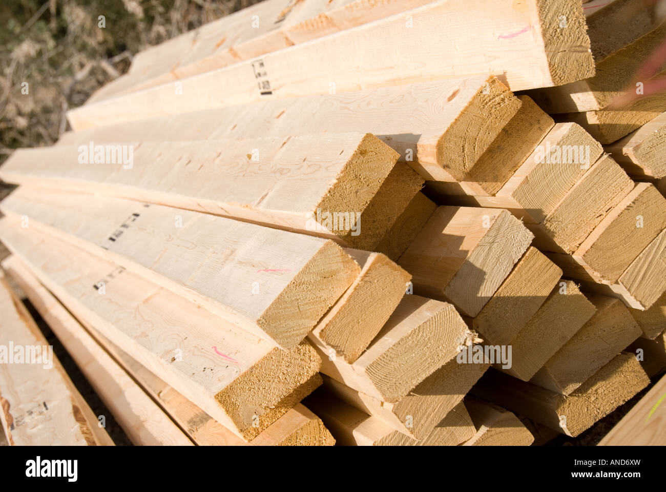 A stack of lumber waiting to be used in a new construction project ...