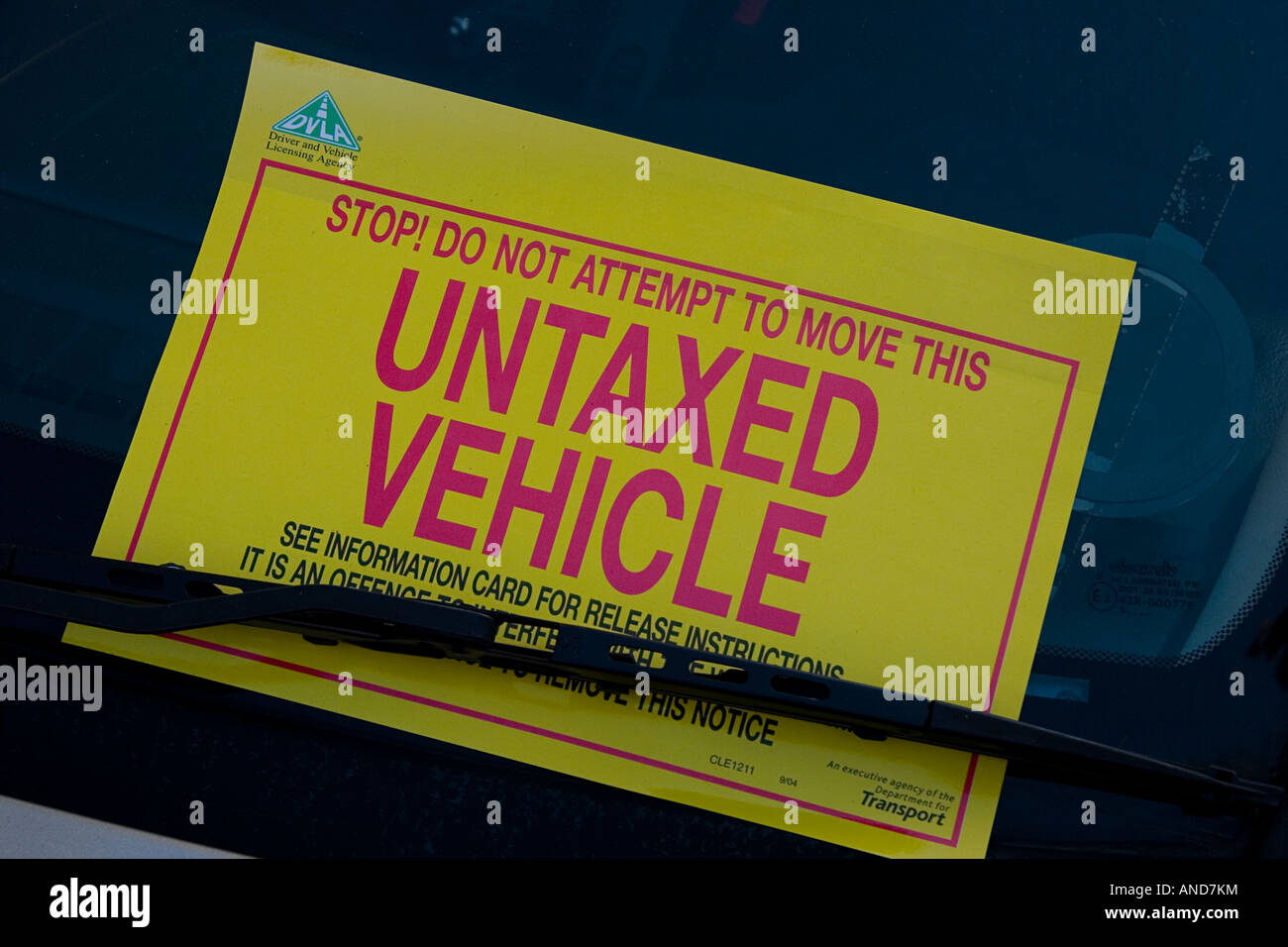 DVLA notice displayed on untaxed car parked at the kerbside Stock Photo ...