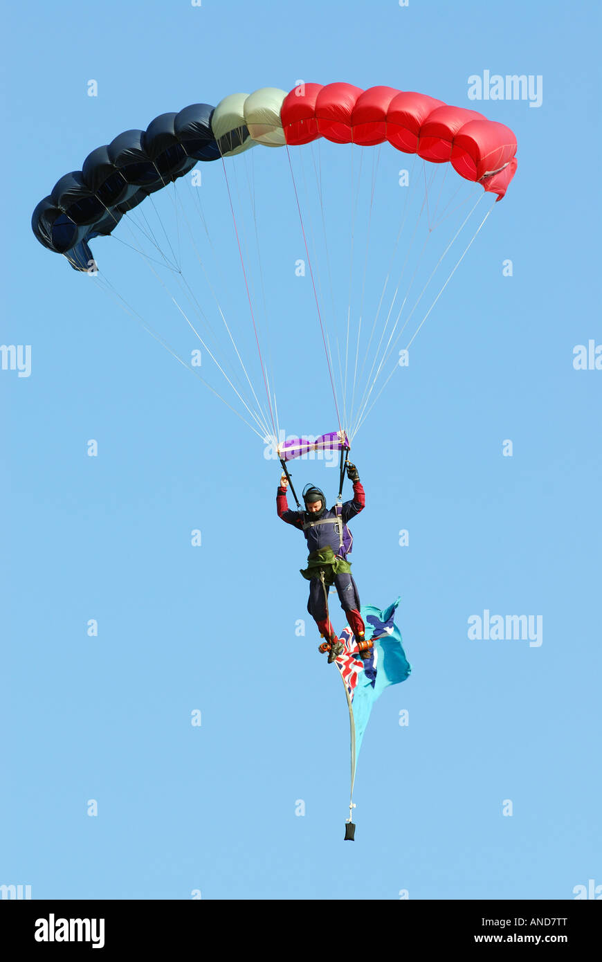 a parachutist from the Red Devils parachute display team with a ...