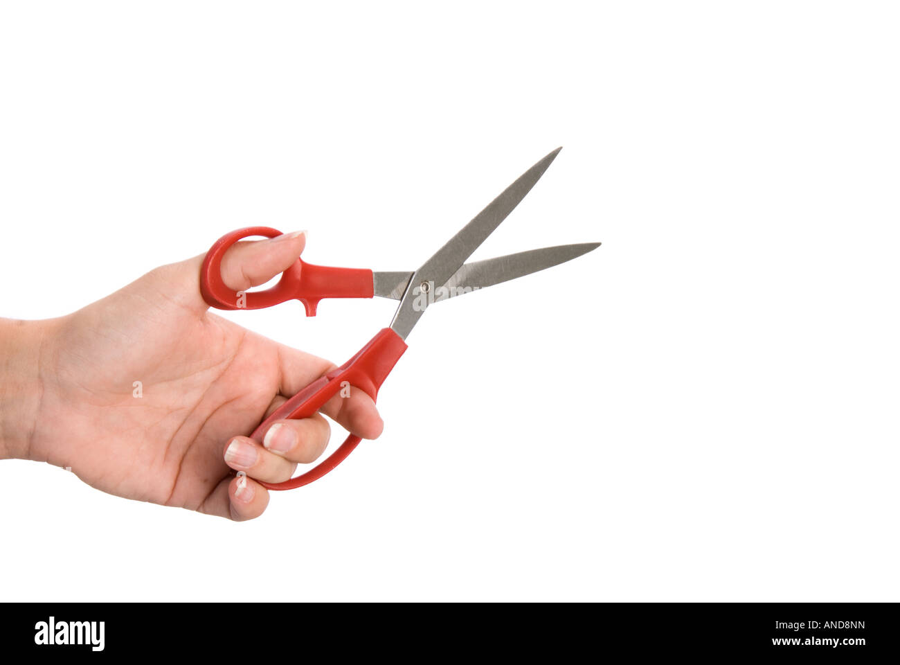 Hand with scissors Cut Out Stock Images & Pictures - Alamy