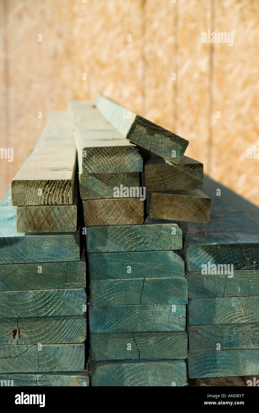 A stack of lumber waiting to be used in a new construction project ...
