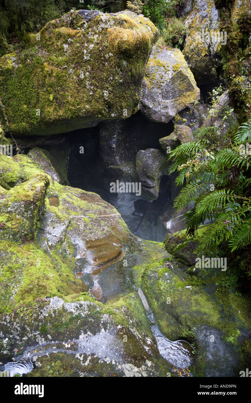 Rock formations made by a ferocious waterfall at The Chasm, Near ...
