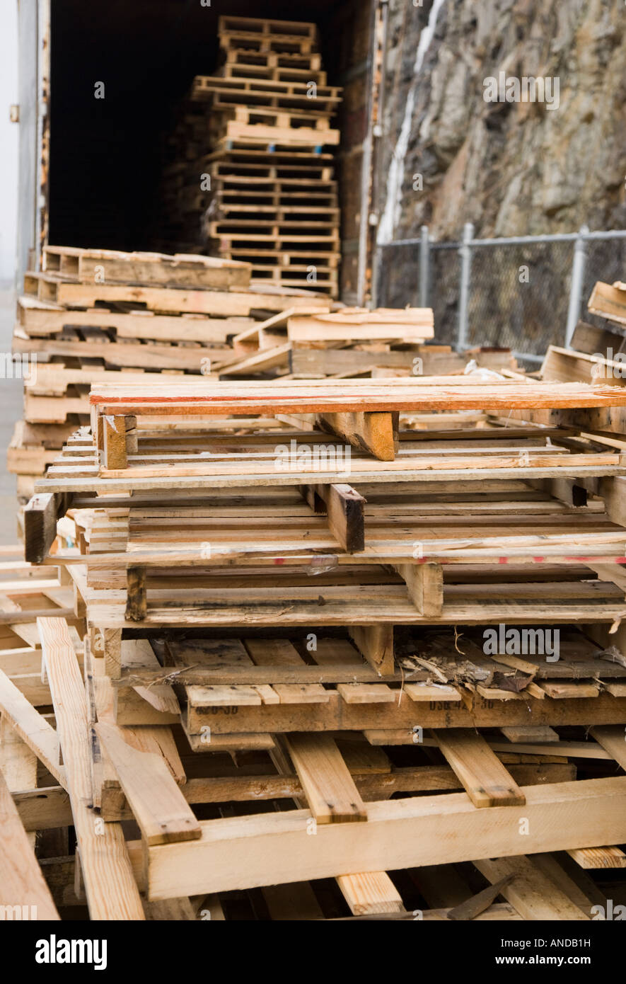 Empty wooden pallets behind a trailer Stock Photo - Alamy