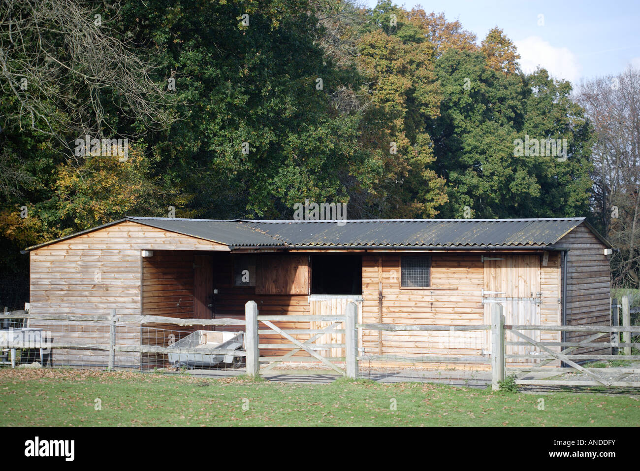 Horse stable block in a field Stock Photo - Alamy