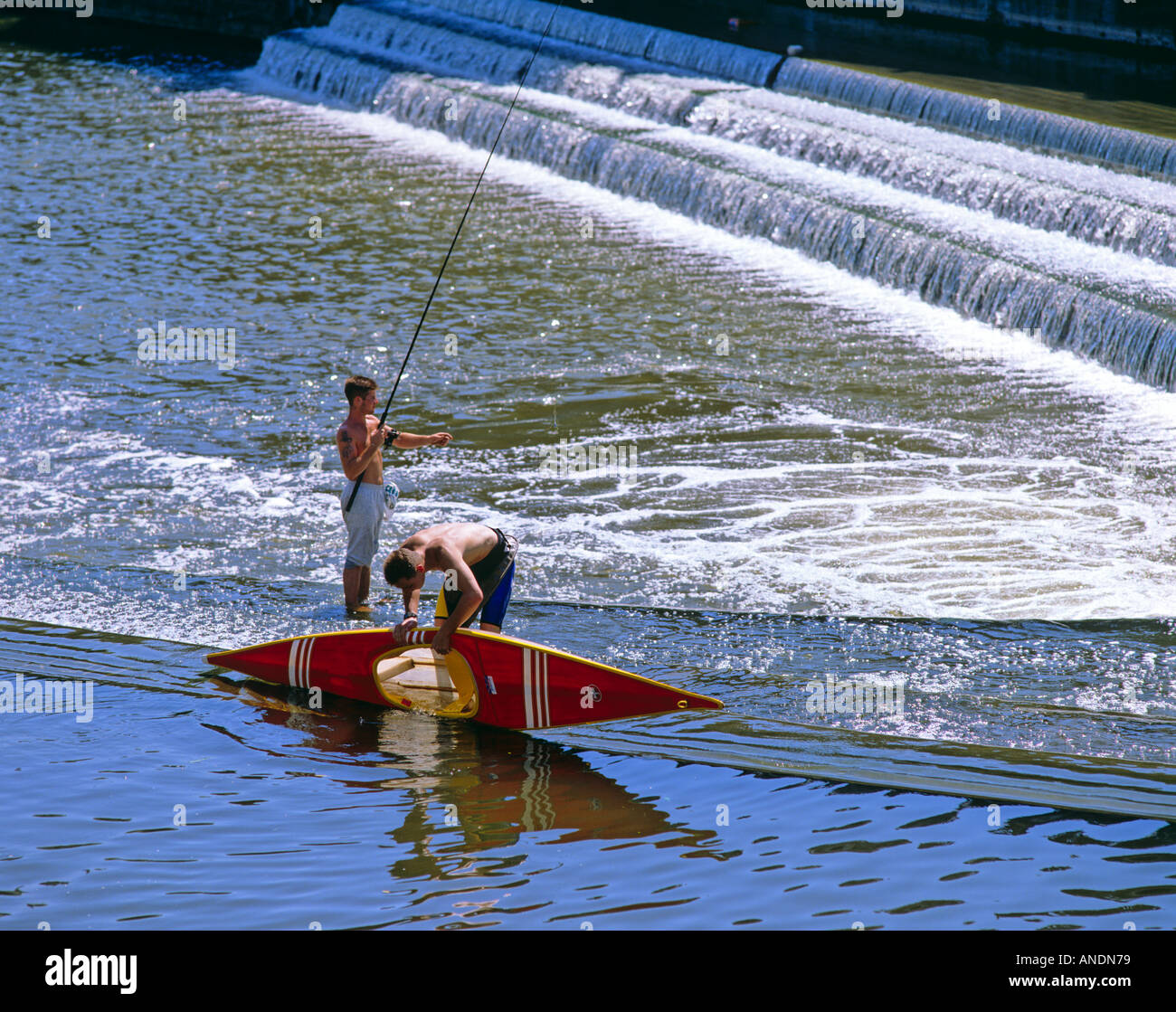 People enjoy summer on the river Avon by the Pulteney Bridge in Bath ...