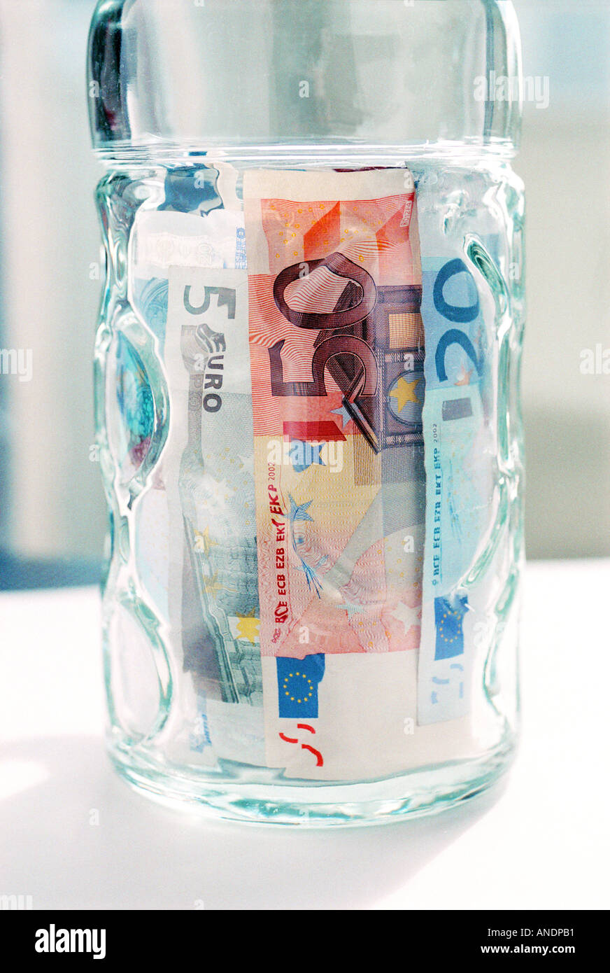 Dollar Euro glass bottle full concept conceptual Stock Photo - Alamy