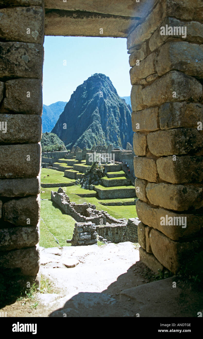 Machu Picchu Inca ruins and Huayna Picchu through stone doorway, Machu ...