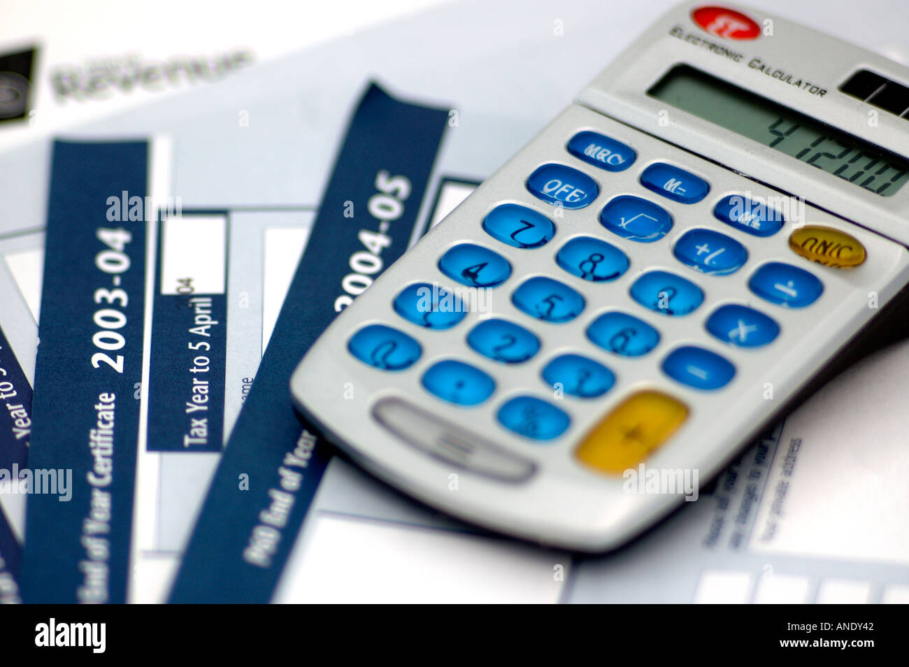 Calculator and tax papers Stock Photo - Alamy