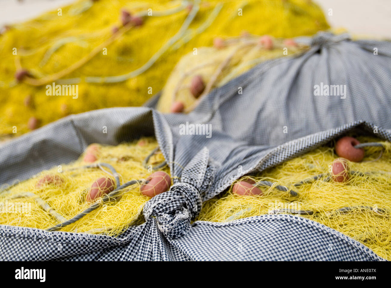 tied up yellow fishing nets Stock Photo - Alamy
