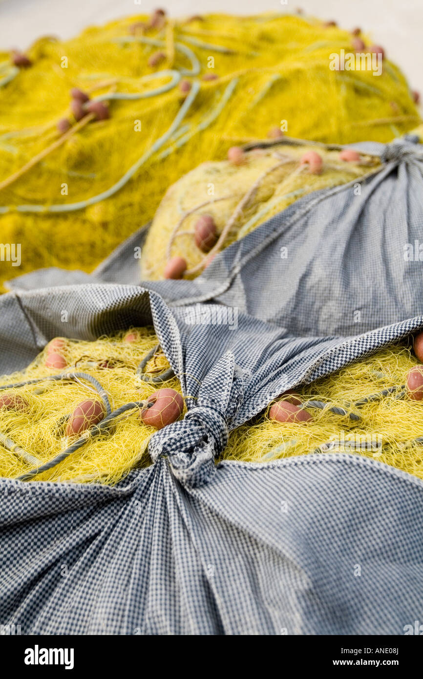 tied up yellow fishing nets Stock Photo - Alamy