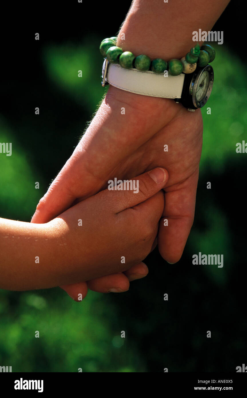 Parent and Child Holding Hands Stock Photo - Alamy