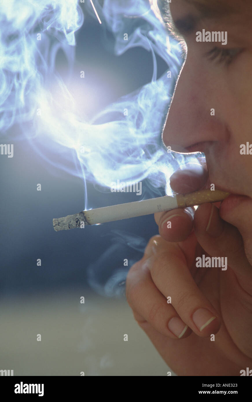 Close-up profile of man smoking a cigarette Stock Photo - Alamy