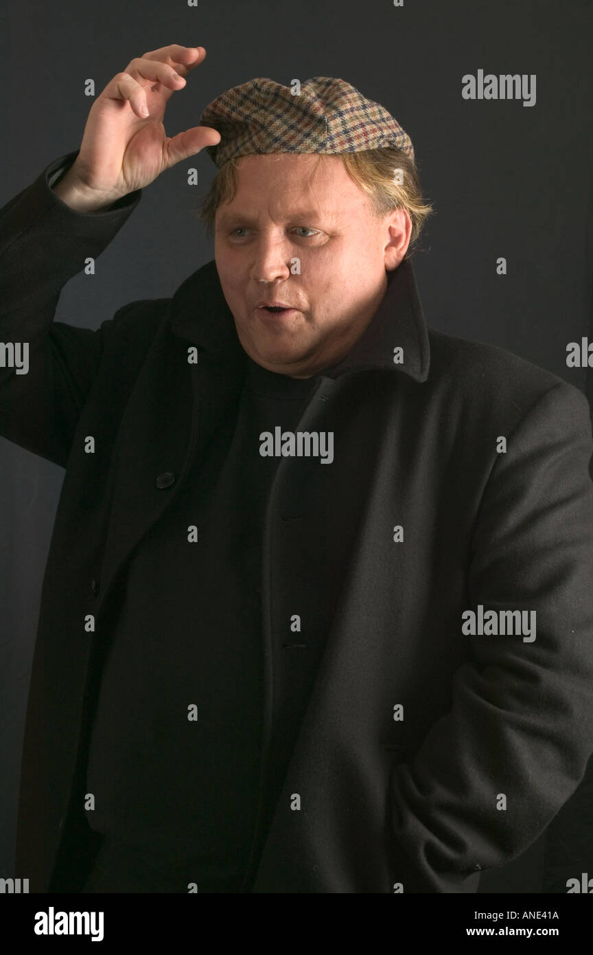 Funny man in cap and Overcoat Stock Photo - Alamy