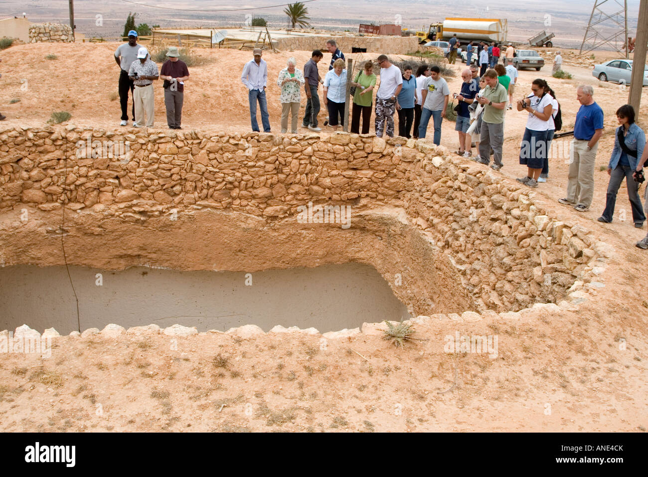 Gharyan, Libya. Tourists Looking down into Troglodyte House from Ground ...