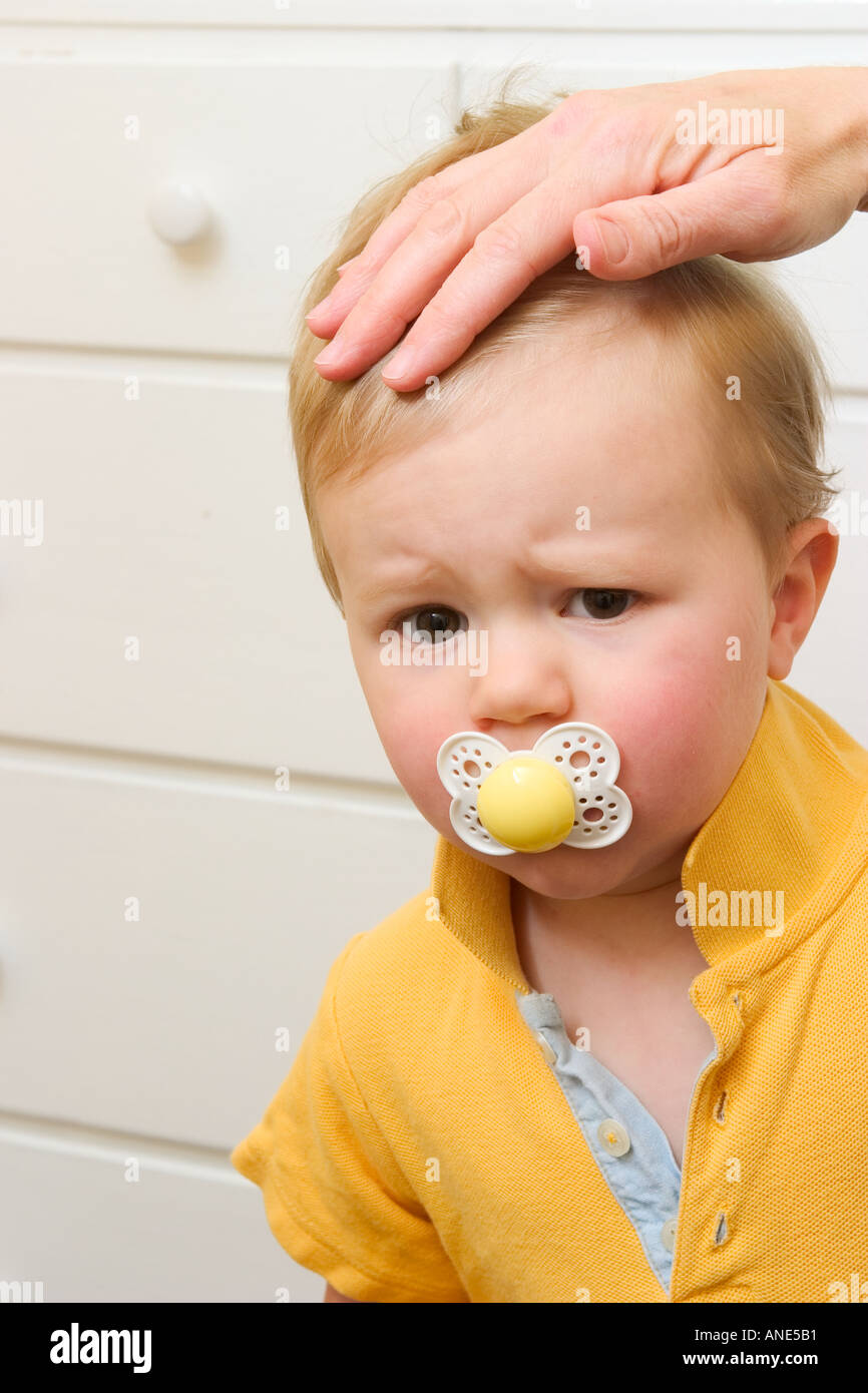Baby boy frowning sad hi-res stock photography and images - Alamy