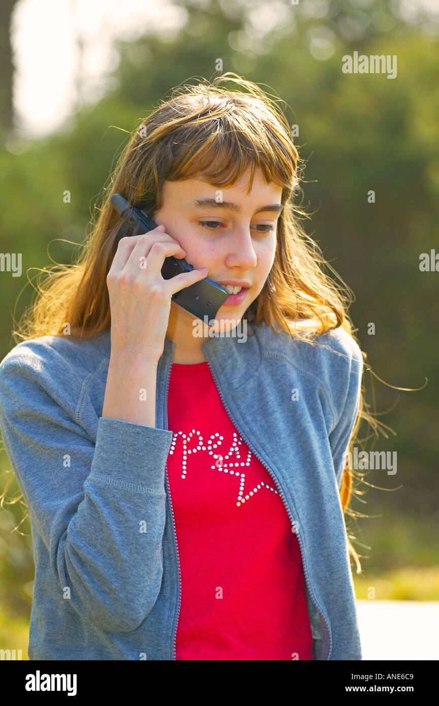 Teenager calling home with a mobile phone Stock Photo - Alamy