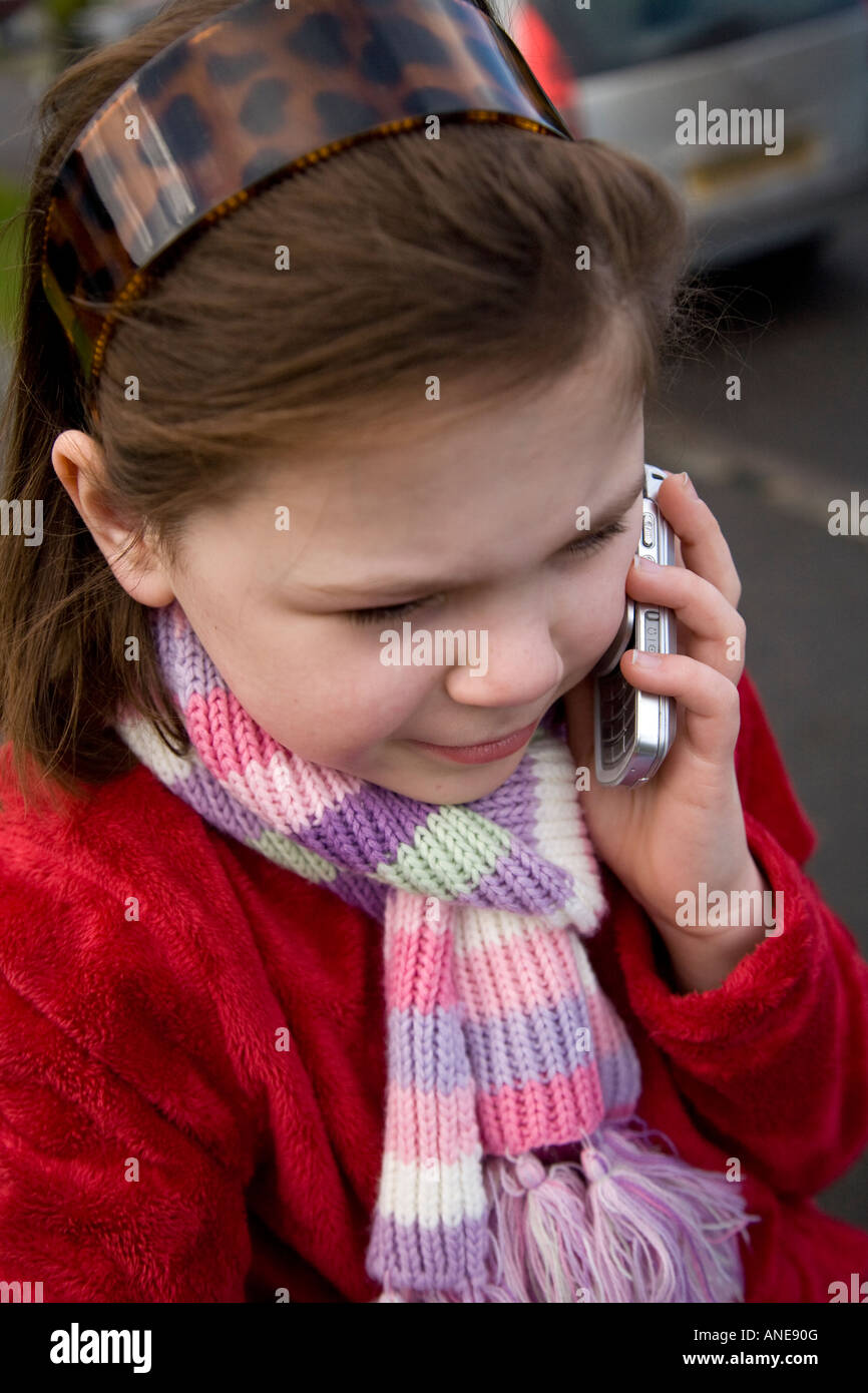Young concerned girl talking on mobile phone Stock Photo - Alamy