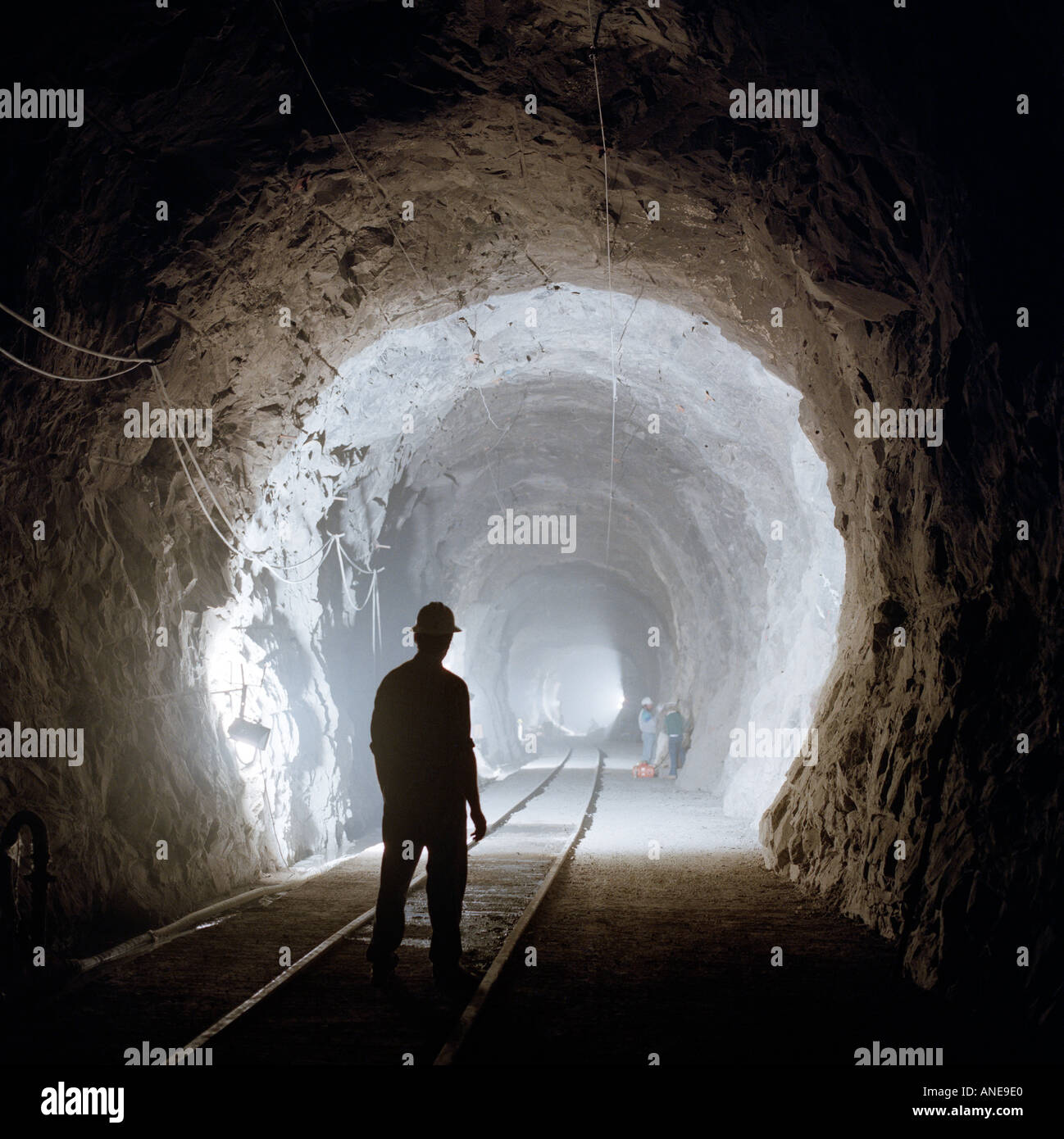 A tunneller approaches his work site through an access adit on the ...