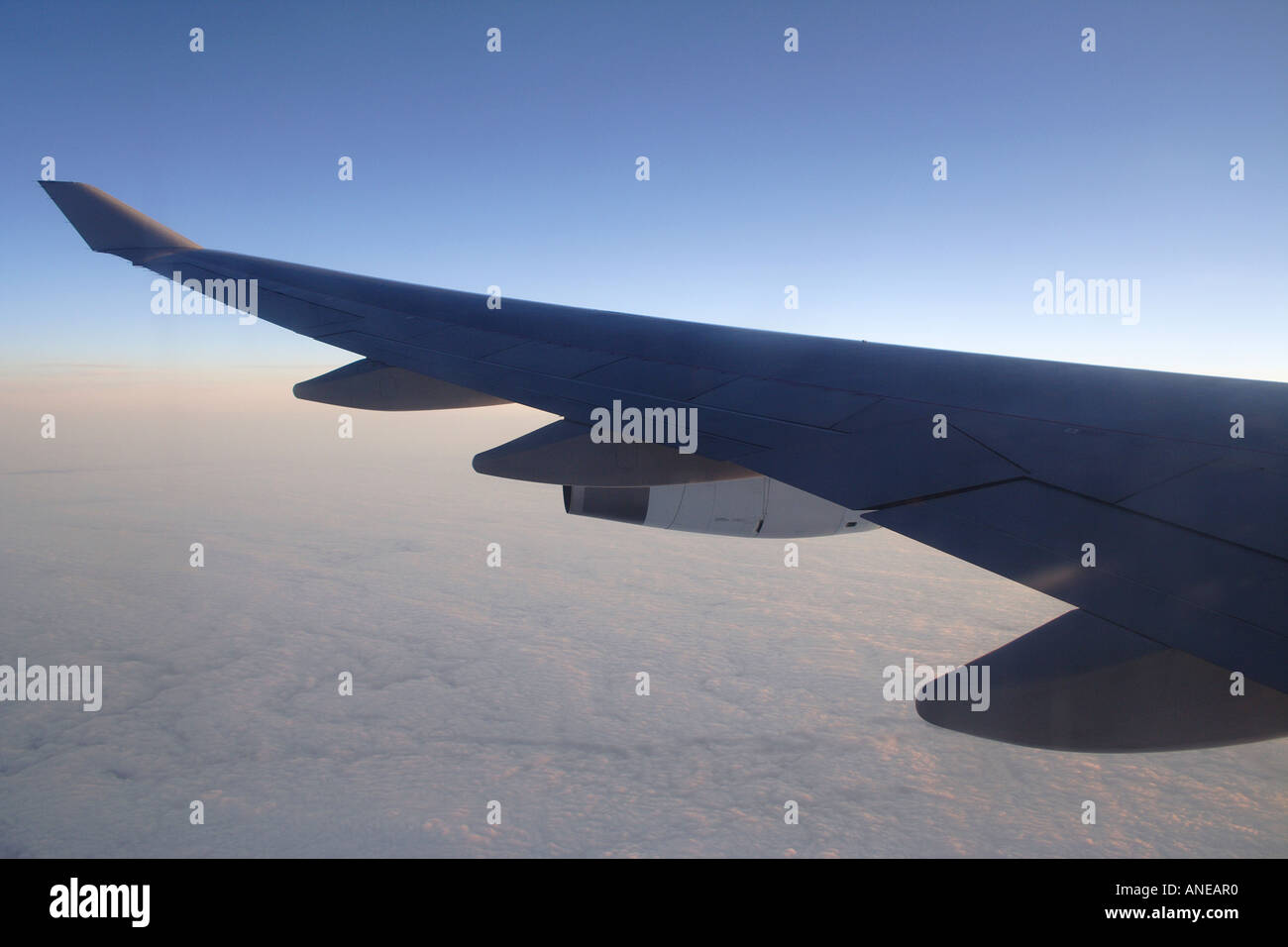 Commercial Jet Airplane Wing in Flight above Clouds Stock Photo - Alamy