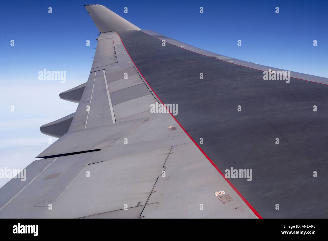 Commercial Jet Airplane Wing in Flight above Clouds Stock Photo - Alamy