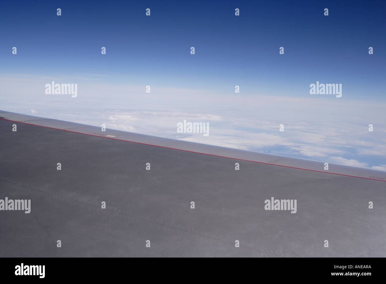 Commercial Jet Airplane Wing in Flight above Clouds Stock Photo - Alamy