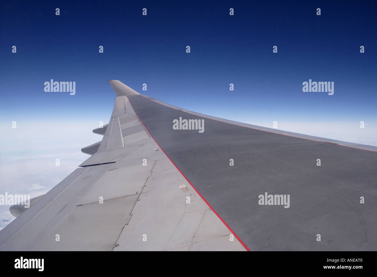 Commercial Jet Airplane Wing in Flight above Clouds Stock Photo - Alamy