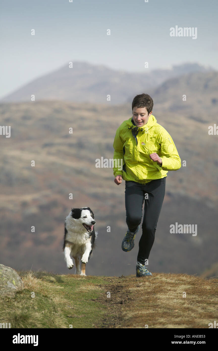 female runner with dog Stock Photo - Alamy