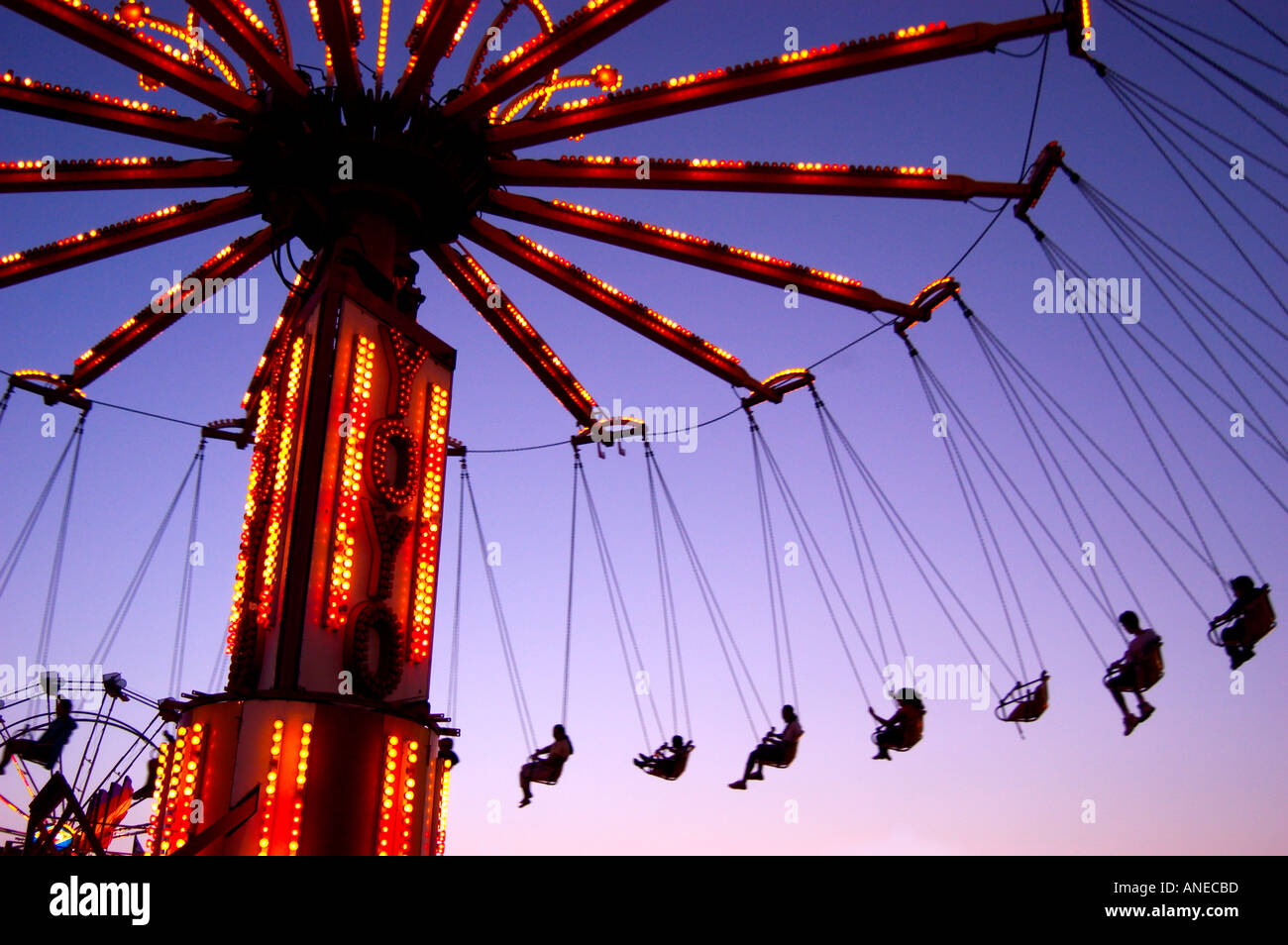 silhouette carnival swing ride Stock Photo - Alamy