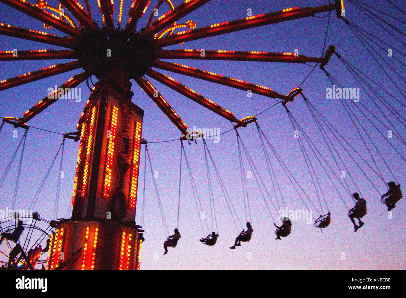 silhouette carnival swing ride Stock Photo - Alamy