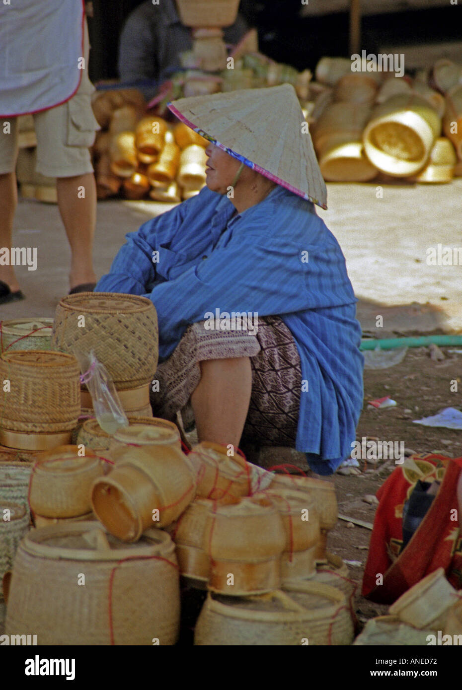 Indigenous woman with traditional conical straw hat sit sell handmade ...