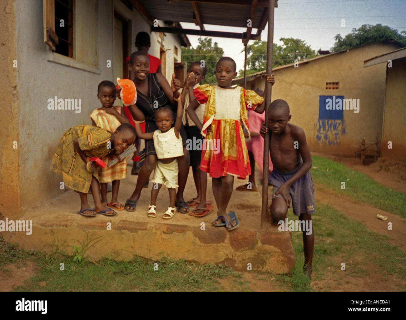 Portrait group shanty town woman boy girl pose play outdoor poor look ...