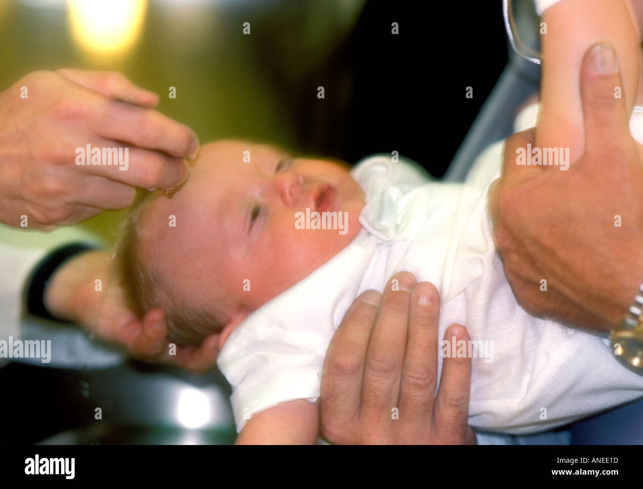 Priest baptizing hi-res stock photography and images - Alamy