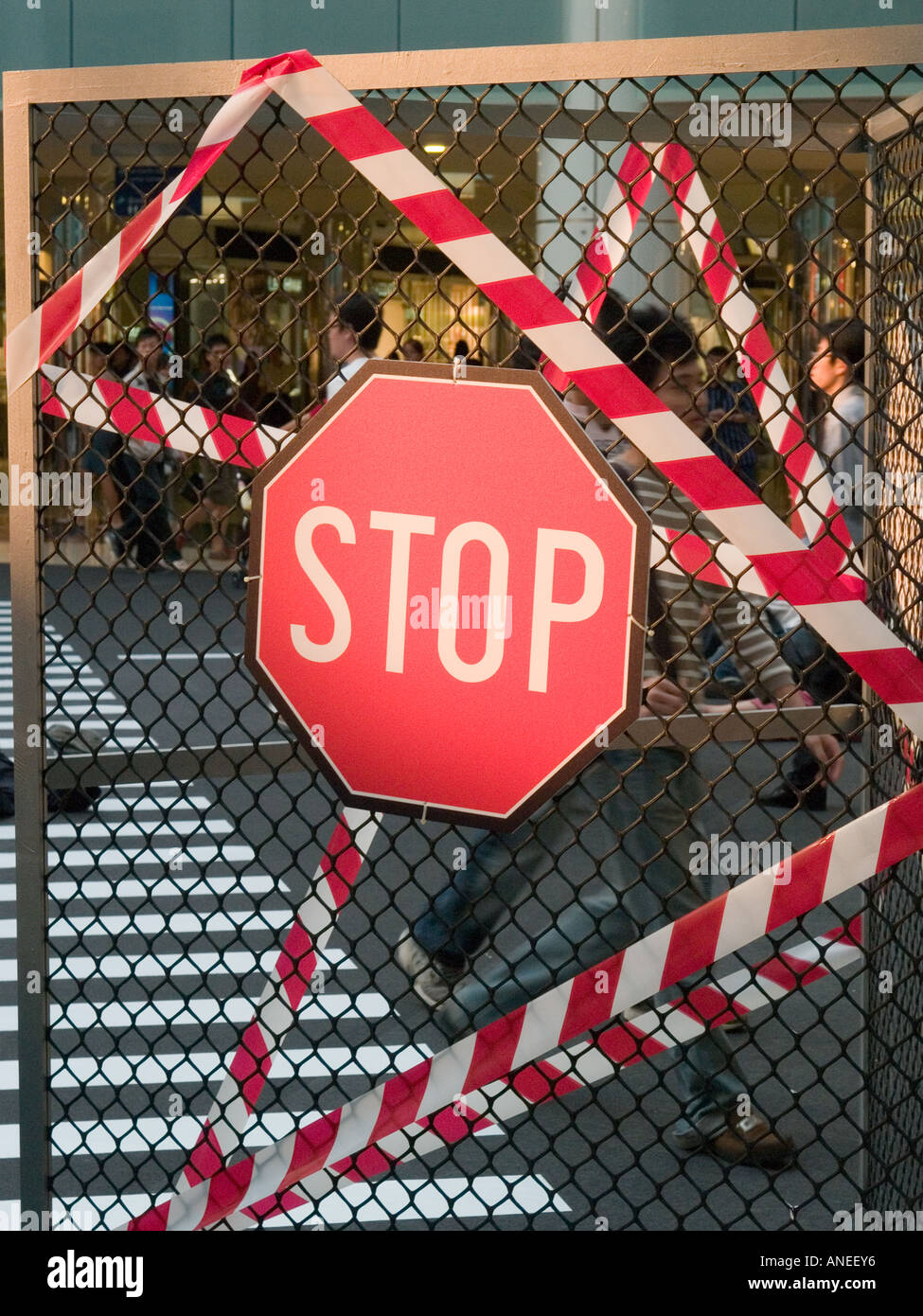 Stop sign with red cordon tape Stock Photo - Alamy