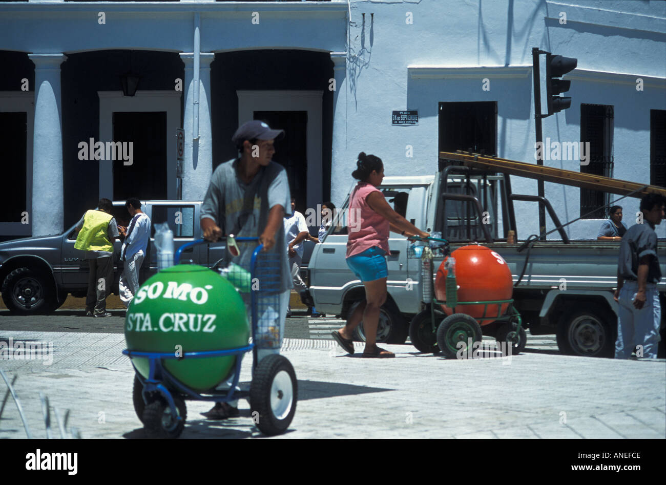 Soft Drink Vendors with Their Wheeled Drinks Dispensers Stock Photo - Alamy