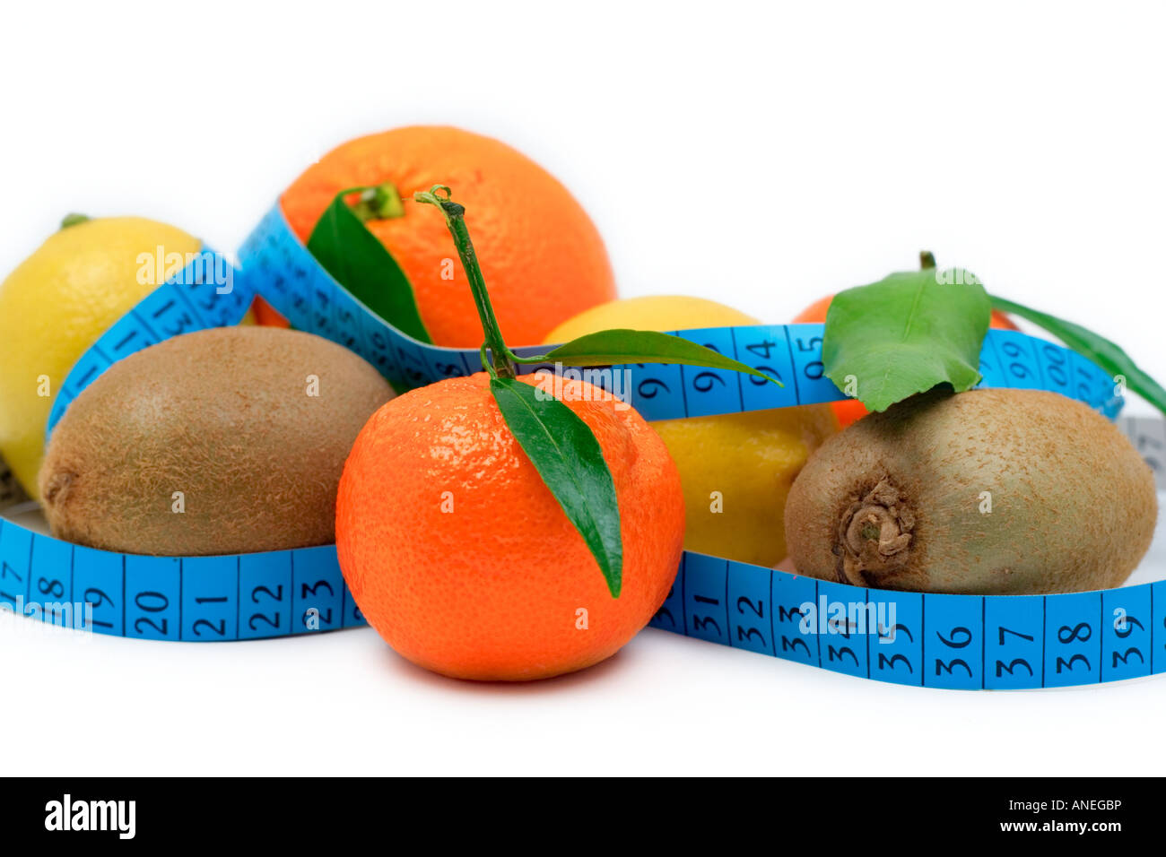 Various fruits wrapped around a tape Stock Photo - Alamy