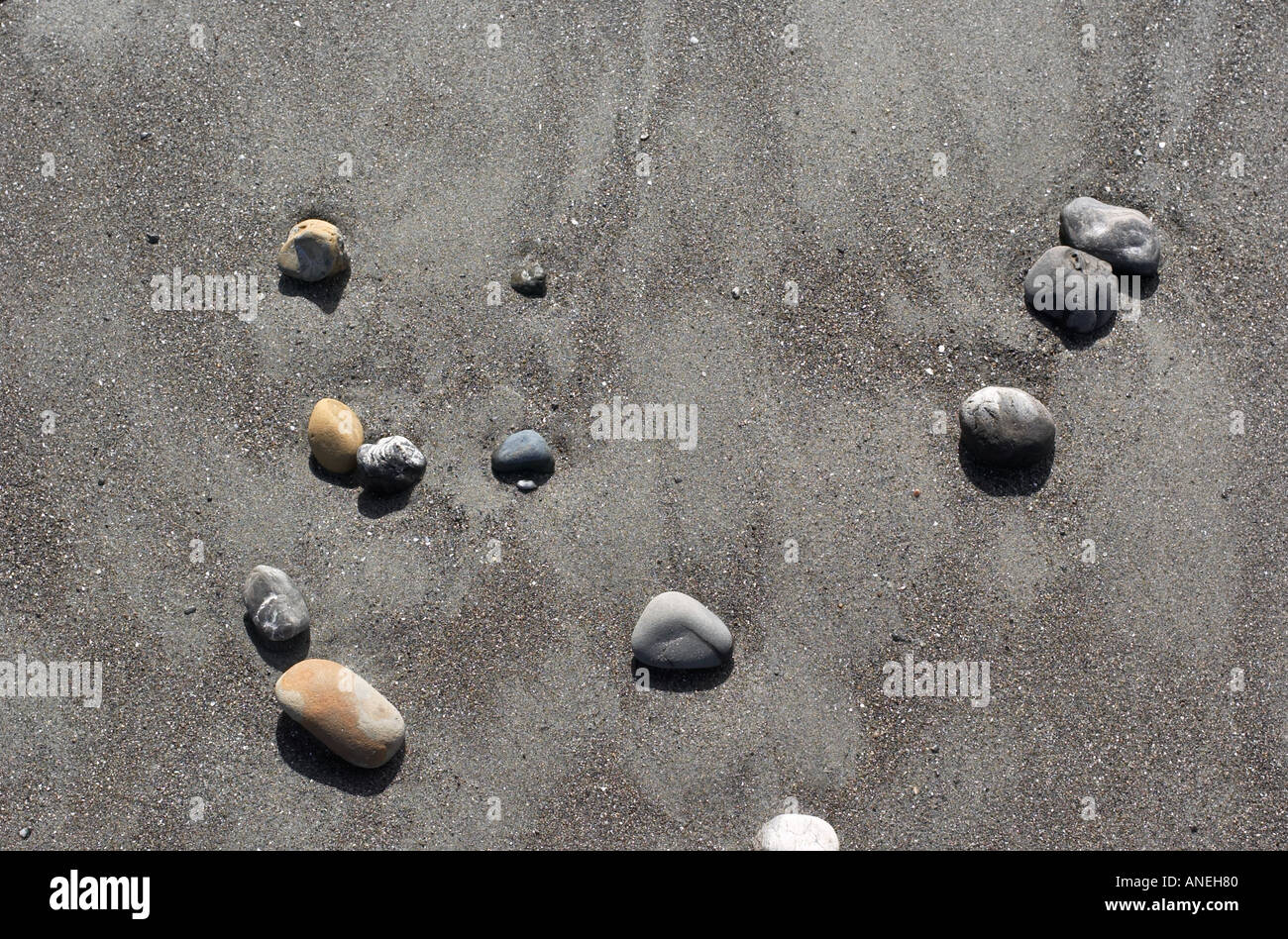 sandy beach with pebbles Stock Photo - Alamy