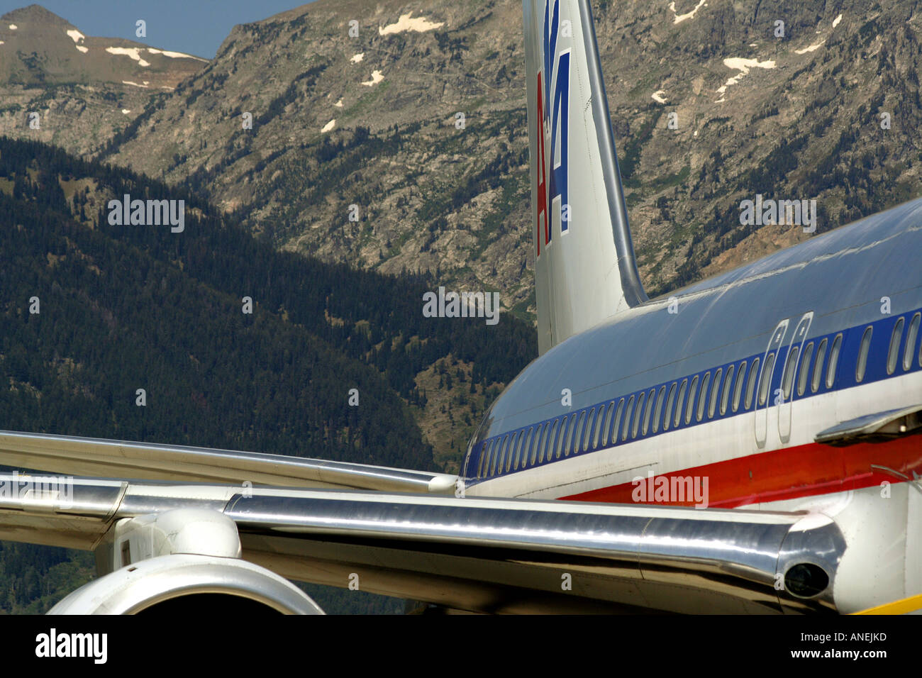 Tail Section of a Commercial Jet with Grand Teton Mountains Stock Photo ...