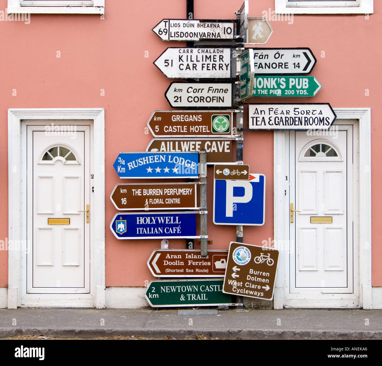 Road Signs between two house doors. Ballyvaughan, County Clare, Ireland ...