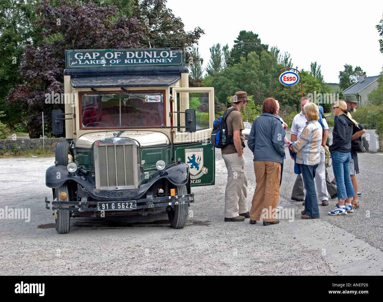 Old fashioned tourist bus and sightseers. Gap of Dunloe, County Kerry ...