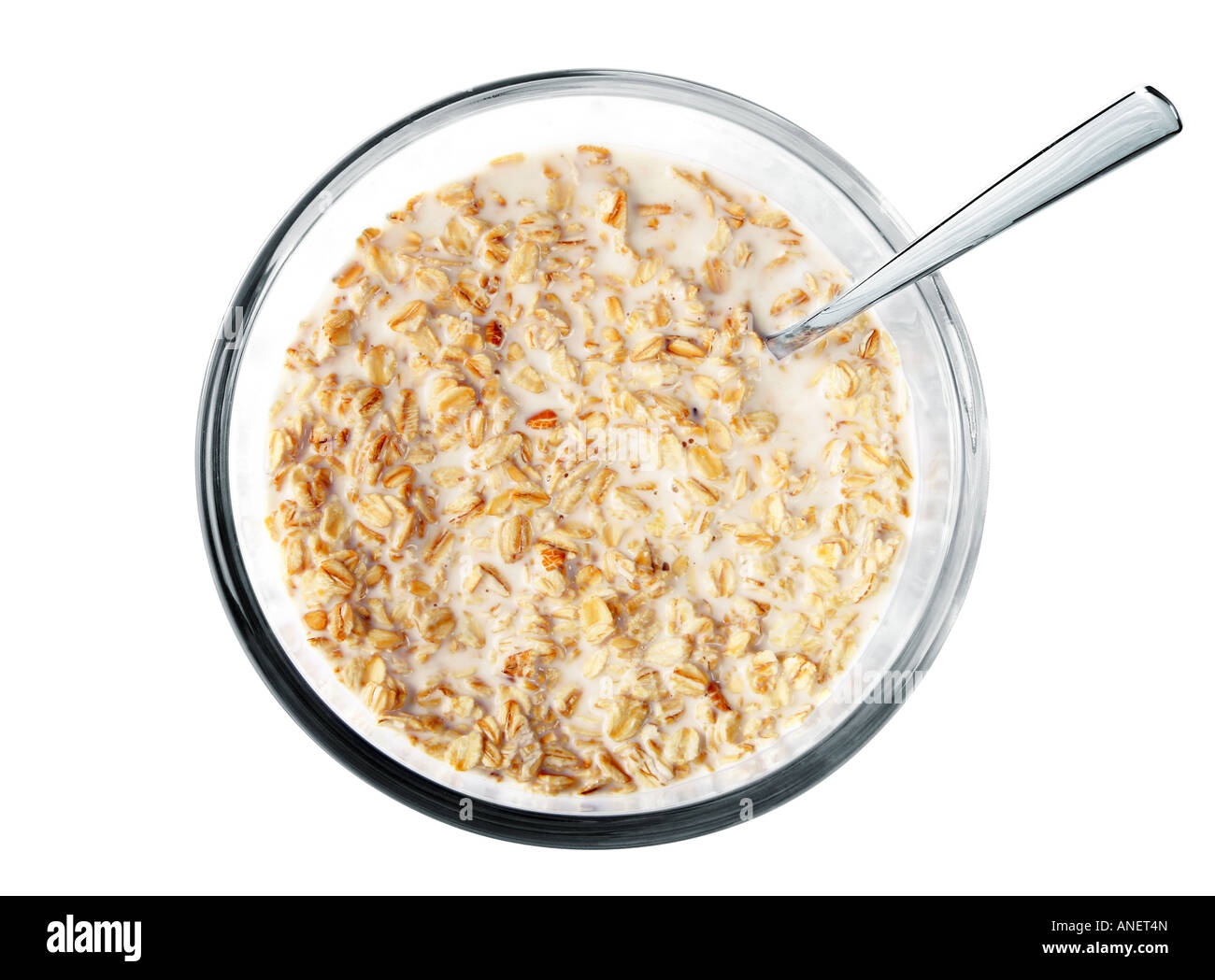 Porridge in galss pan isolated on white background Stock Photo - Alamy