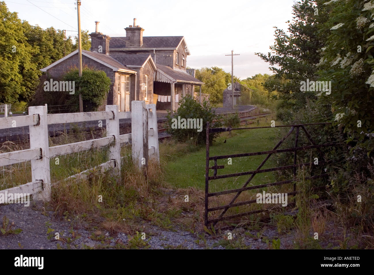 Old Railway Station, with Iron gate and rickety fence. Adare, County ...