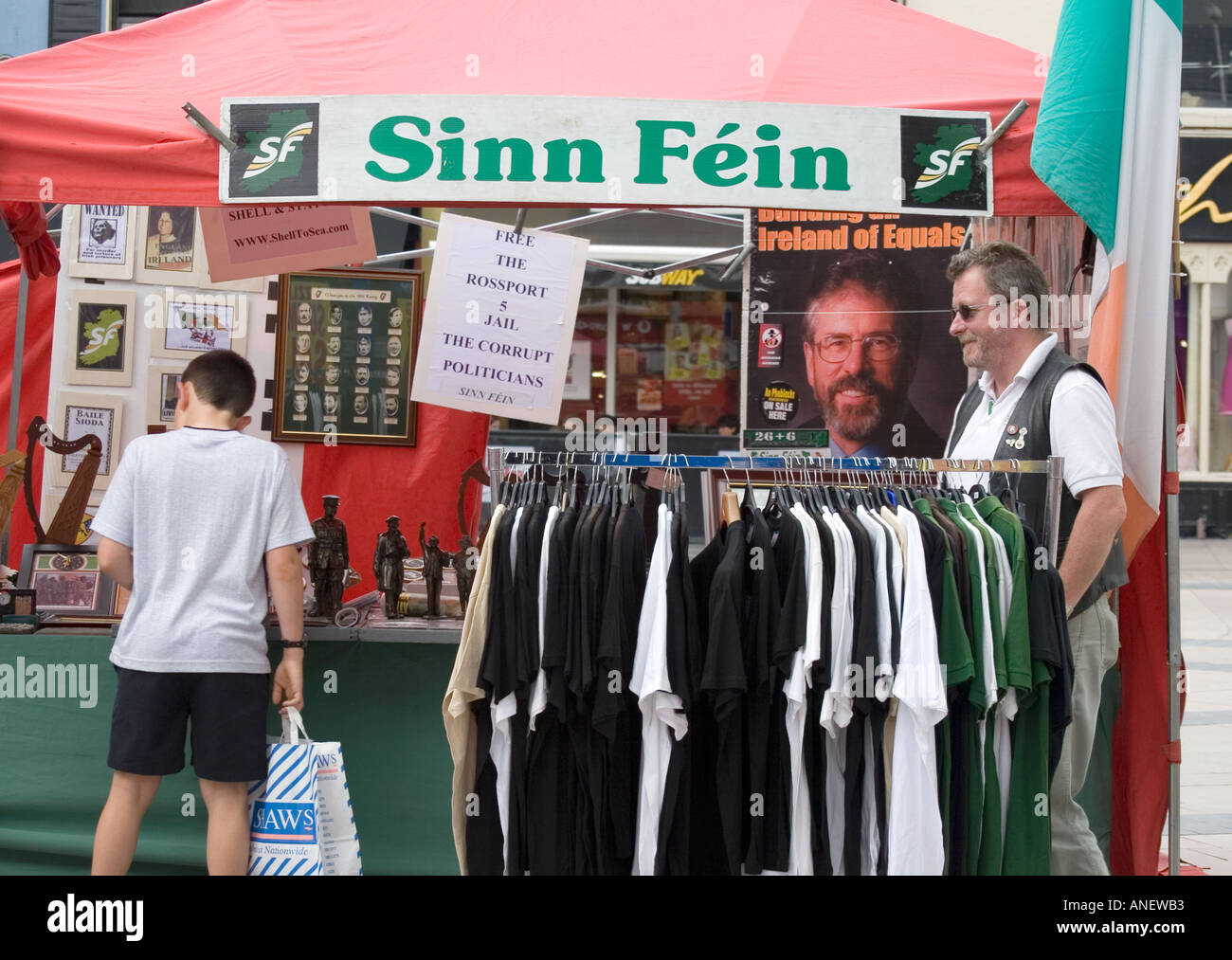 Young boy looking at goods for sale on Sinn Fein Market Stall, Tralee ...