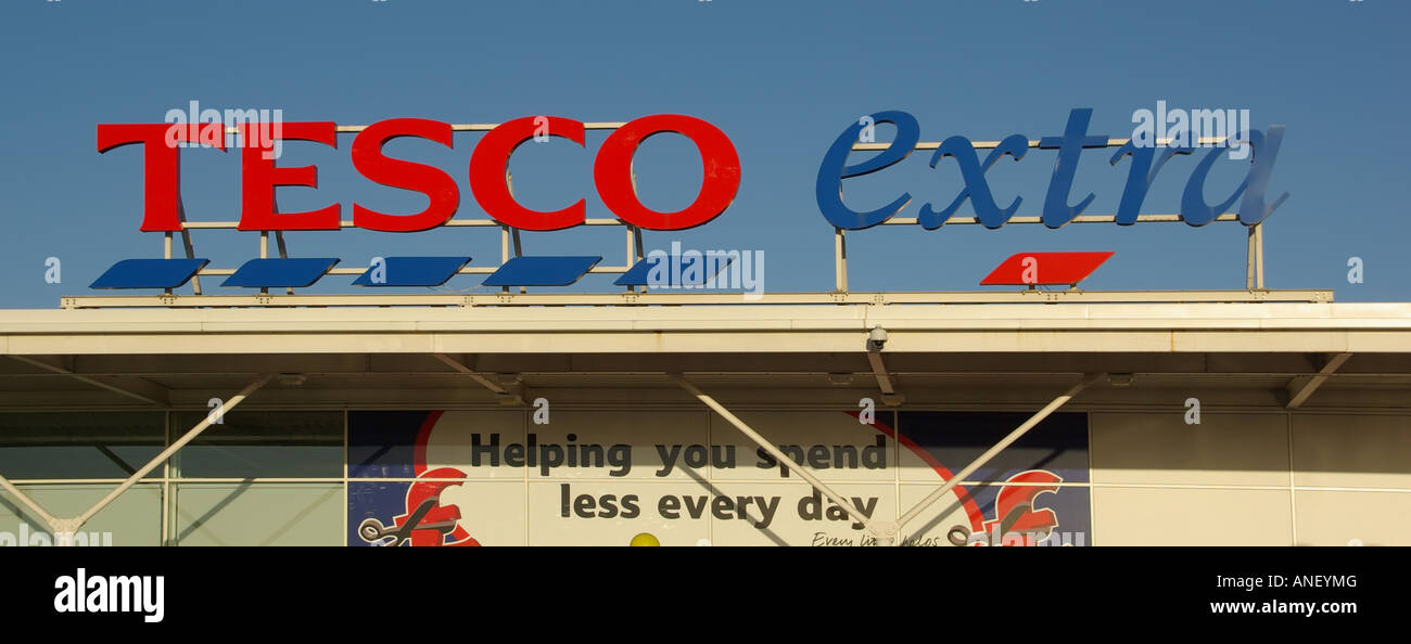 Close up view Tesco Extra supermarket logo brand & store sign above ...