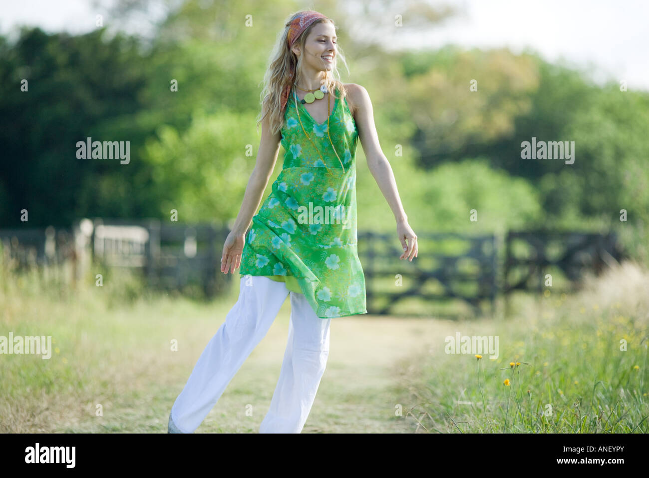 Young woman standing in rural Stock Photo - Alamy