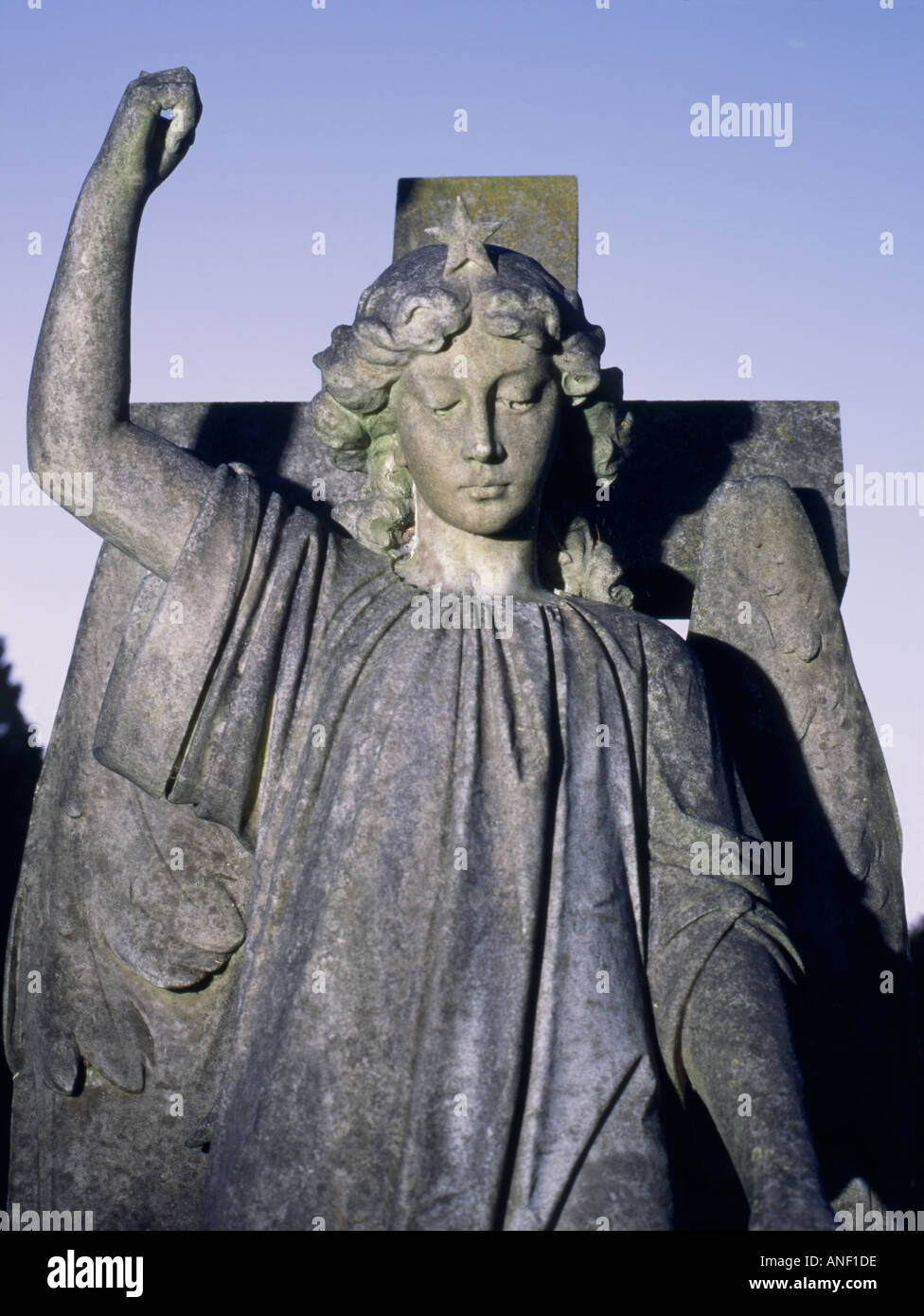 statue of angel with cross Stock Photo - Alamy